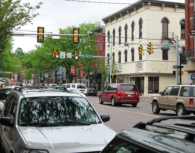 Main Street's traffic lights orchestrate the gentle rhythm of downtown life, where "rush hour" means three cars waiting at the intersection. 