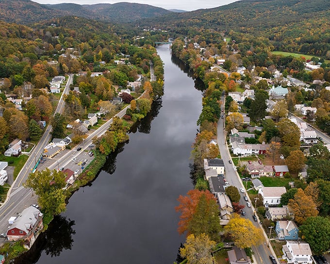 The river divides yet connects the community, a liquid main street flowing through the heart of this picture-perfect town.