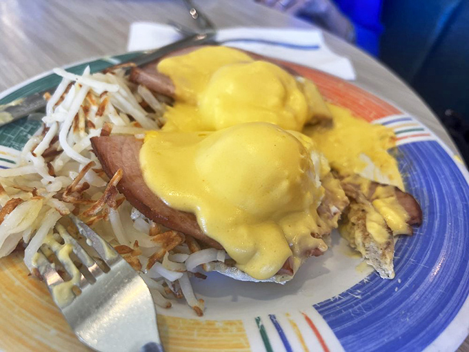 The Eggs Benedict&mdash;where hollandaise sauce flows like liquid sunshine over Canadian bacon islands on toasted English muffin continents.