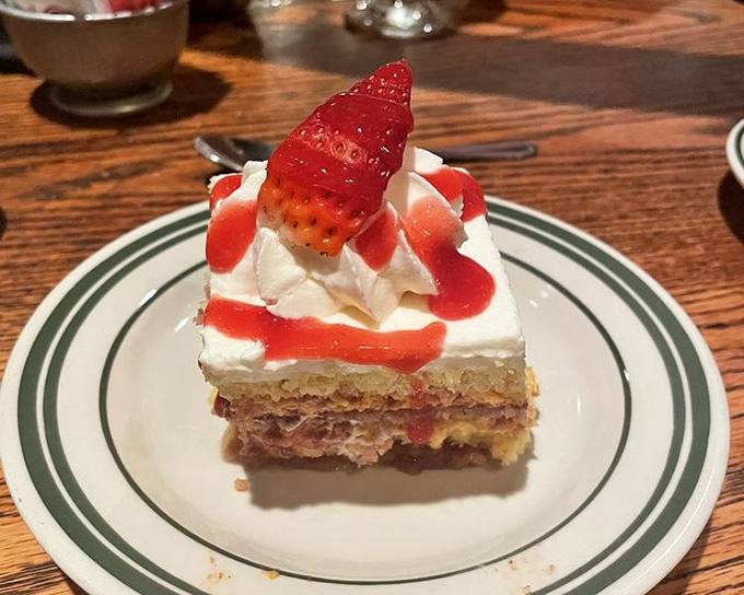 Strawberry dessert that looks like it's dressed for a night out. Layers of cake, cream, and berries performing a sweet symphony.