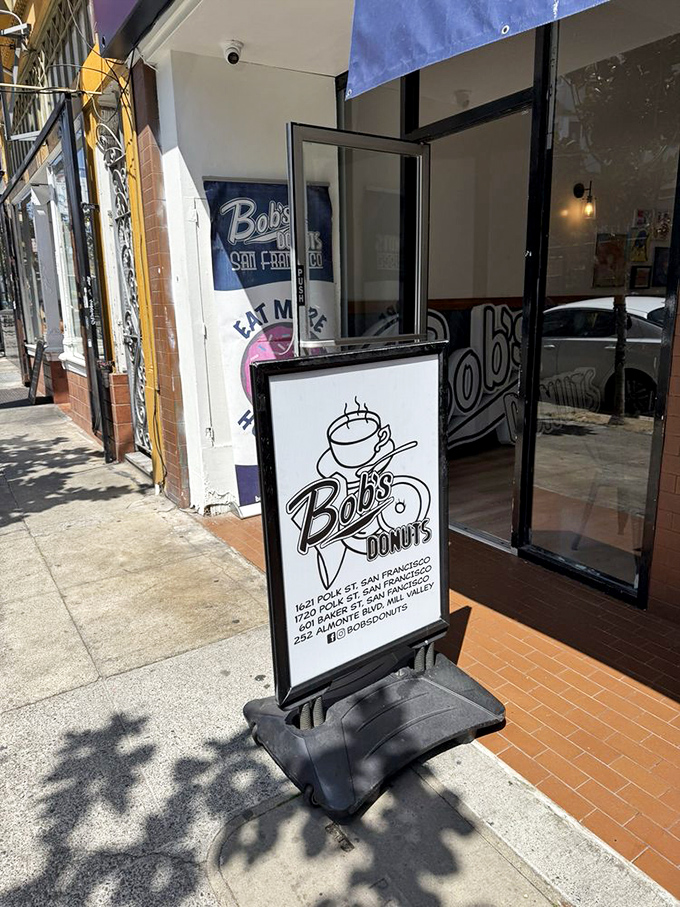 Sidewalk signage that beckons passersby with a simple promise: life-changing donuts await just steps away.