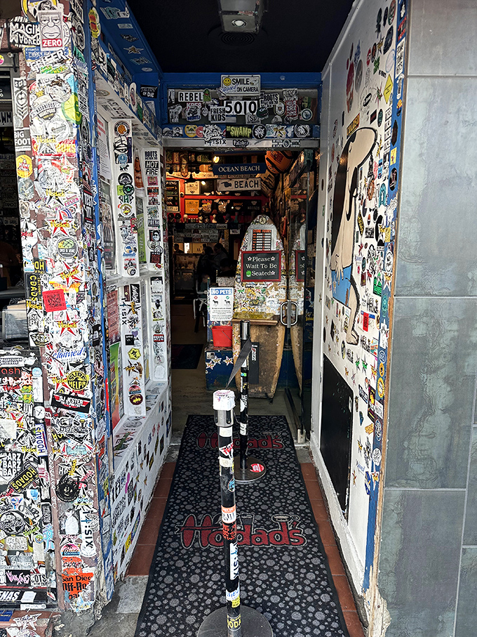 The entrance hallway to Hodad's: where anticipation builds with each step as the aroma of grilled perfection pulls you forward like a burger tractor beam.
