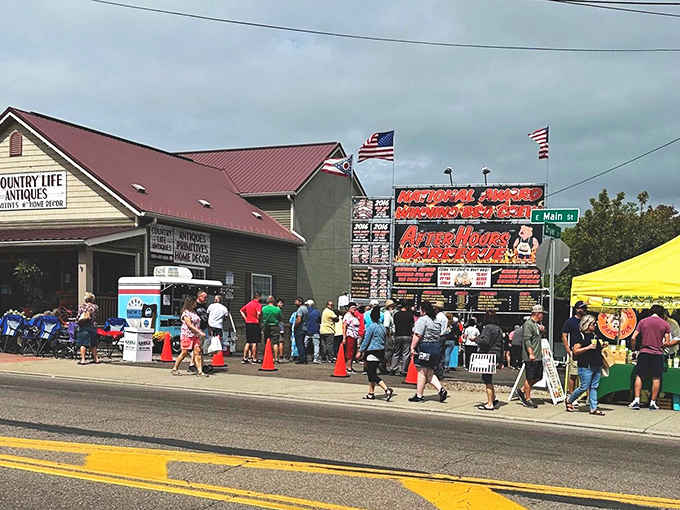 Crowds gather outside Country Life Antiques during a local event, proving Berlin's ability to draw visitors seeking authentic experiences.