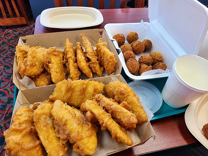 The family meal spread&mdash;a treasure chest of fried delights that turns an ordinary table into a celebration. Sharing is technically required, but never easy.