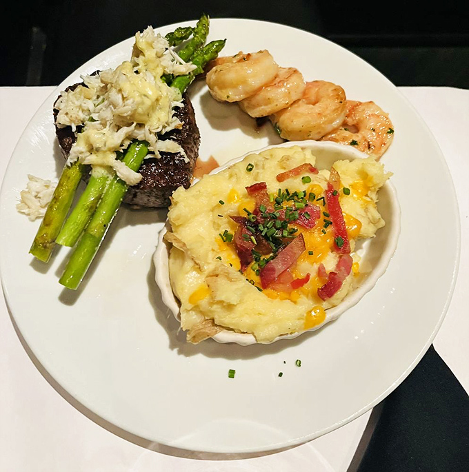 The holy trinity of steak dinner perfection: filet mignon, loaded mashed potatoes, and plump shrimp. Tuesday night just became Saturday special.