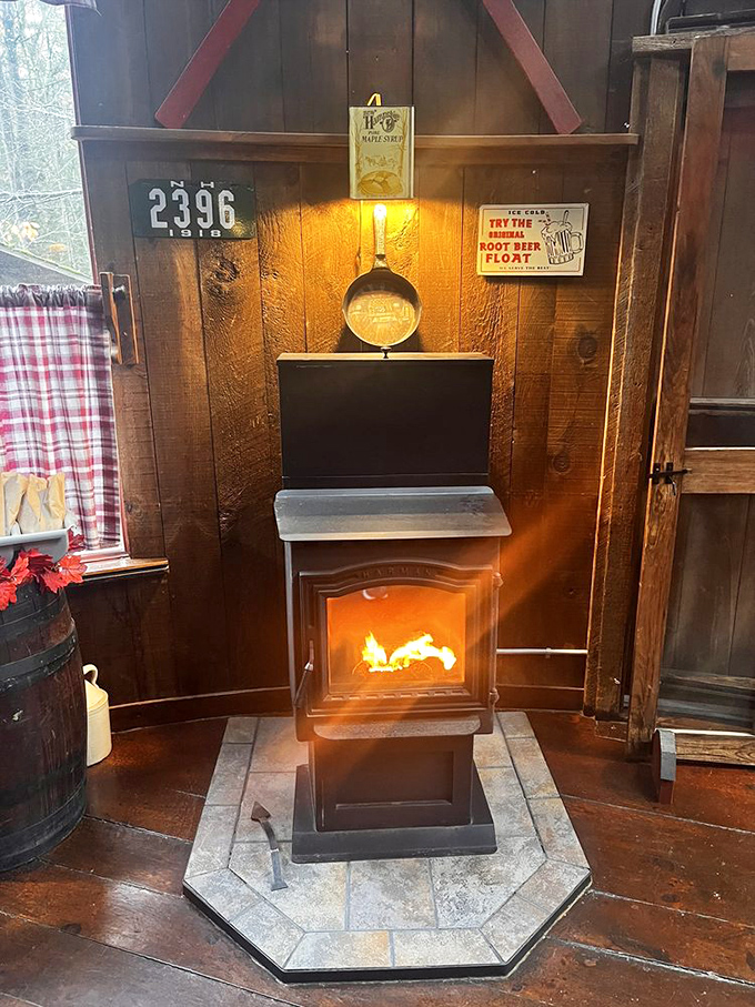 A crackling wood stove that doesn't just warm the room but tells stories of New England winters to visitors from warmer climates.