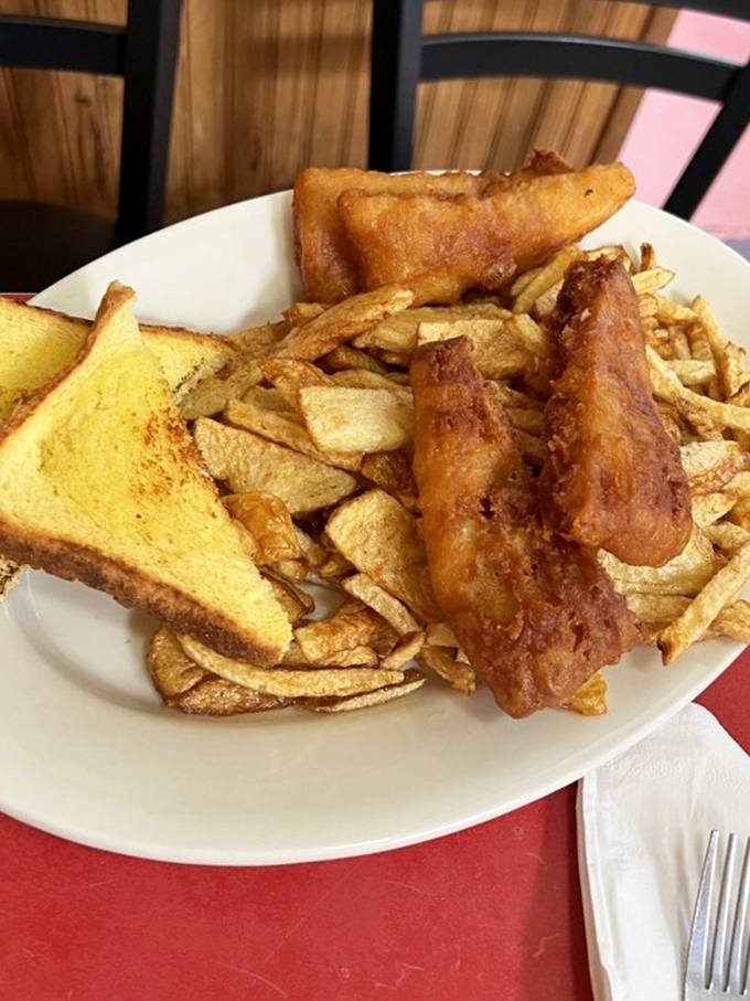 Fish and chips that would make a British pub proud, with a golden batter that crackles with each bite.