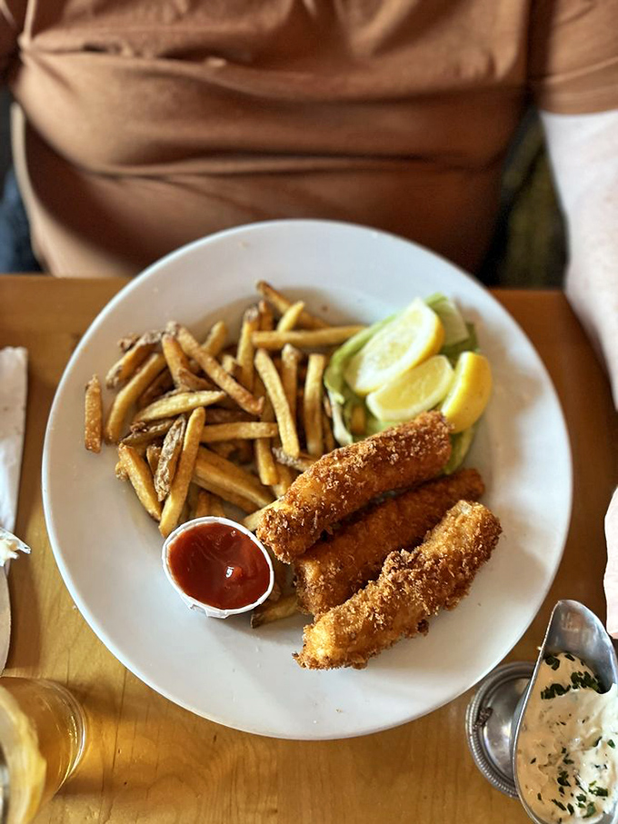 Fish and chips that transport you to a seaside holiday. Golden, crispy perfection with fries that deserve their own fan club.