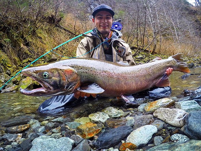 That's not just a fish&mdash;that's a swimming trophy with fins! The proud angler's smile says it all: dinner plans have officially changed.