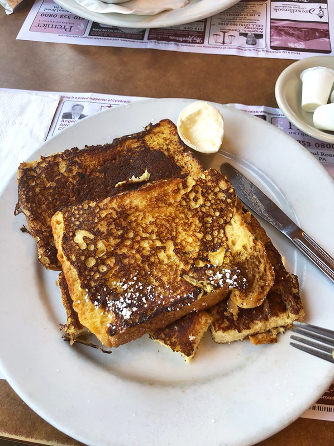French toast that's achieved the golden-brown perfection we all aspire to in life&mdash;dusted with powdered sugar like the first perfect snowfall of winter.