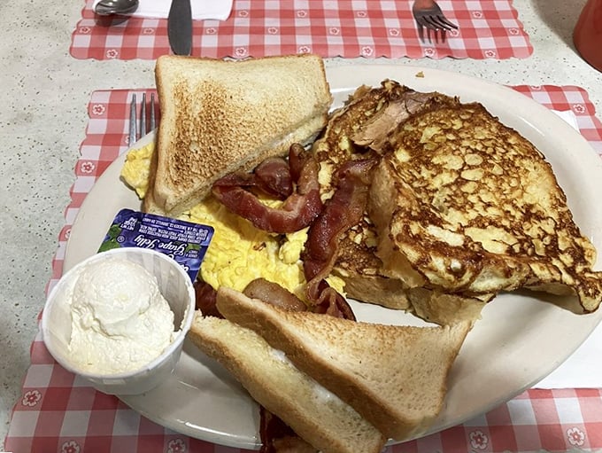 Breakfast of champions: golden French toast, crispy bacon, and eggs that would make a rooster proud to call his own.