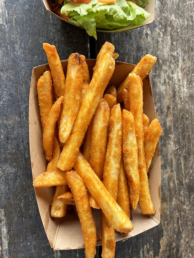 French fries that have clearly been to finishing school&mdash;golden, crisp, and seasoned just enough to make you forget they're just potatoes that got dressed up. 