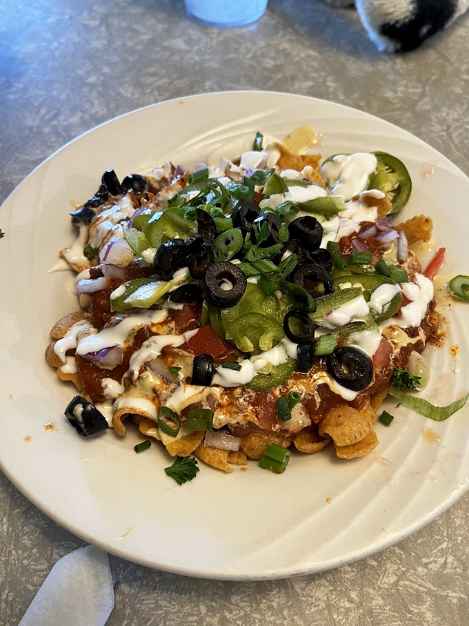 A symphony of textures and flavors conducted on a green plate. The side of creamy sauce is the encore this performance deserves.