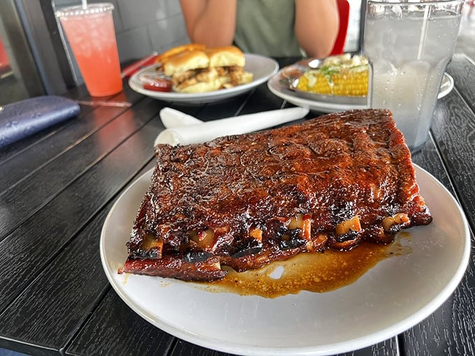 A full rack of ribs glistening with sauce &ndash; the kind of sight that makes vegetarians question their life choices.