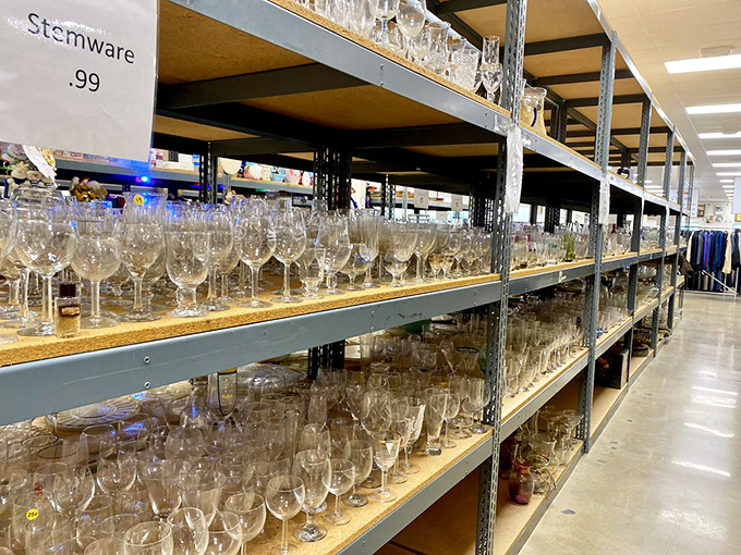Stemware sparkles under fluorescent lights, each glass waiting for its chance to hold everything from bargain box wine to celebratory champagne.