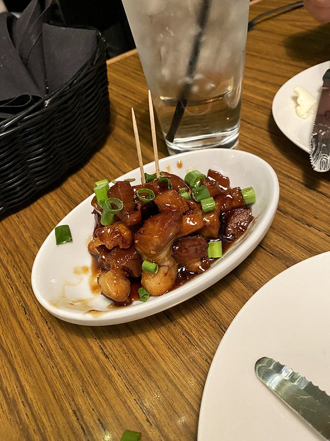 Glazed pork belly bites that dissolve on contact, leaving behind only the memory of sweet-savory perfection and the desire for another round.
