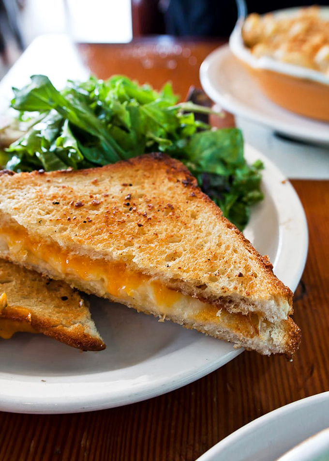 Grilled cheese that doesn't just satisfy&mdash;it silences. That perfect golden crust and molten interior represent humanity's greatest achievement in bread and dairy technology.