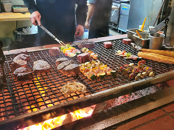 Where the magic happens: Flames lick the underside of that magnificent grill, transforming raw ingredients into edible poetry.