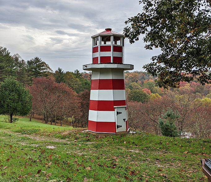 This cheerful lighthouse stands as proof that even in landlocked Ohio, someone said, "You know what this hill needs? Maritime charm!"