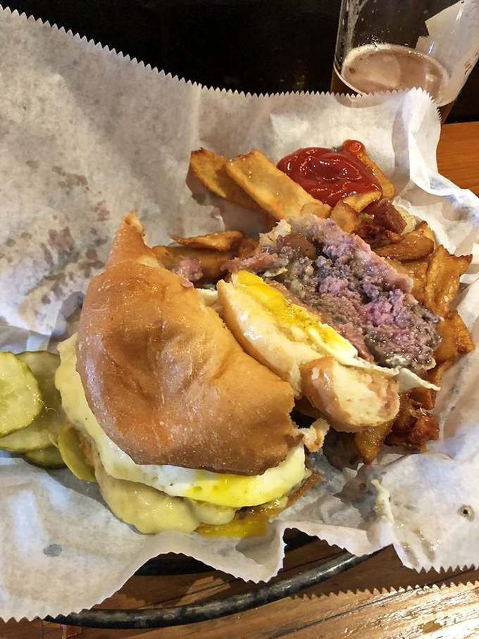 The Helicopter Burger in all its glory—a towering achievement that requires both hands, several napkins, and absolutely no shame.