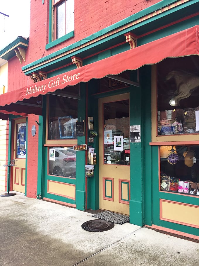 The Midway Gift Store's vintage storefront with its classic red awning offers treasures that tell Kentucky's story, one souvenir at a time.