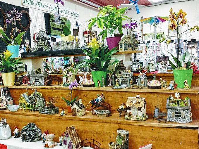 Miniature houses and vibrant plants create whimsical landscapes that belong in the gardens of people who use "delightful" in casual conversation.