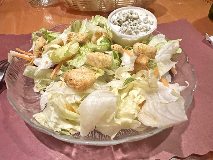 A house salad that doesn't apologize for being exactly what it is: crisp, fresh, and the perfect opening act for the meaty headliner to come.