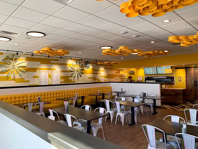 Warm wood tones and golden accents create an atmosphere as inviting as the food. Even the walls seem to say, "Stay awhile."