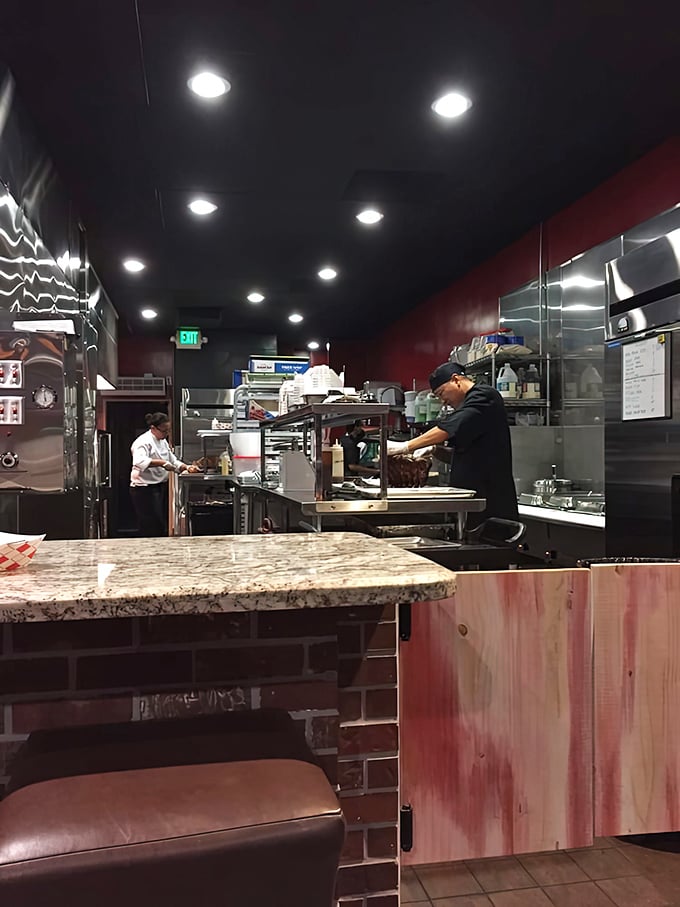 The open kitchen design lets you witness the choreography of barbecue preparation. Nothing to hide when you're doing it right.