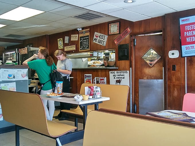 The kitchen window&mdash;where magic happens without pretense. Those vintage signs on the walls have witnessed more food stories than any food blogger.