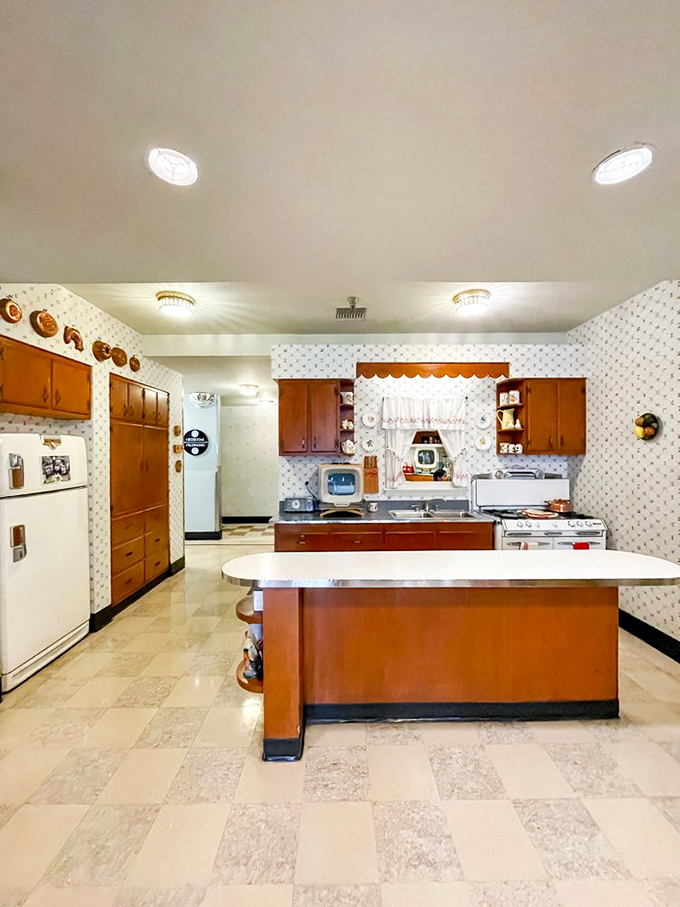 This kitchen isn't a replica—it's a time machine where you half-expect June Cleaver to offer you a freshly baked cookie.