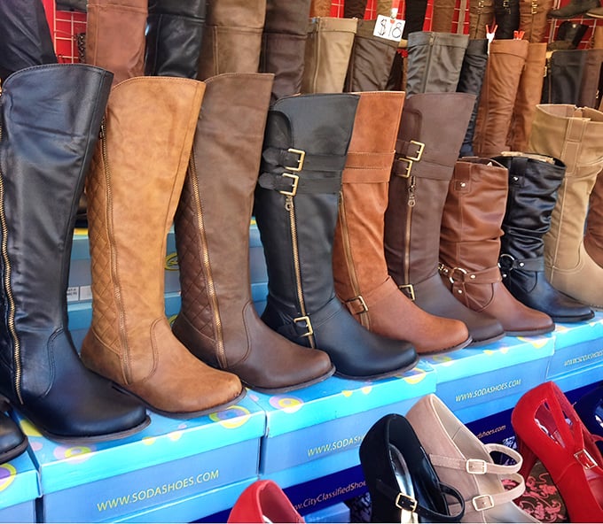 A regiment of boots stands at attention, waiting for the right feet to march them home. Fashion meets function in leather-bound possibilities.