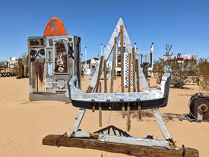 Not seaworthy but certainly eye-worthy! This metallic vessel seems ready to sail across sand dunes rather than ocean waves, its journey purely imaginative.