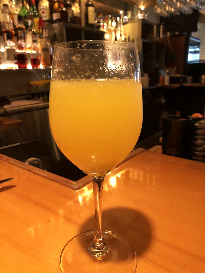 A mimosa that captures sunshine in a glass, proving that sometimes the simplest pleasures&mdash;bubbles and juice&mdash;create the most perfect moments.