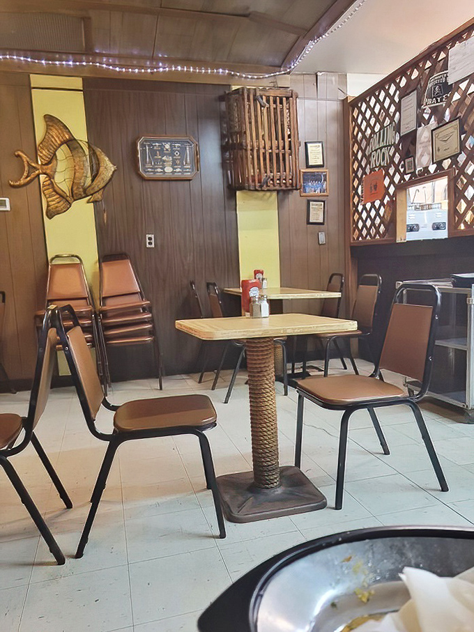 The wooden fish art and bulletin board create that classic "been-here-forever" vibe that no corporate designer could ever authentically replicate.