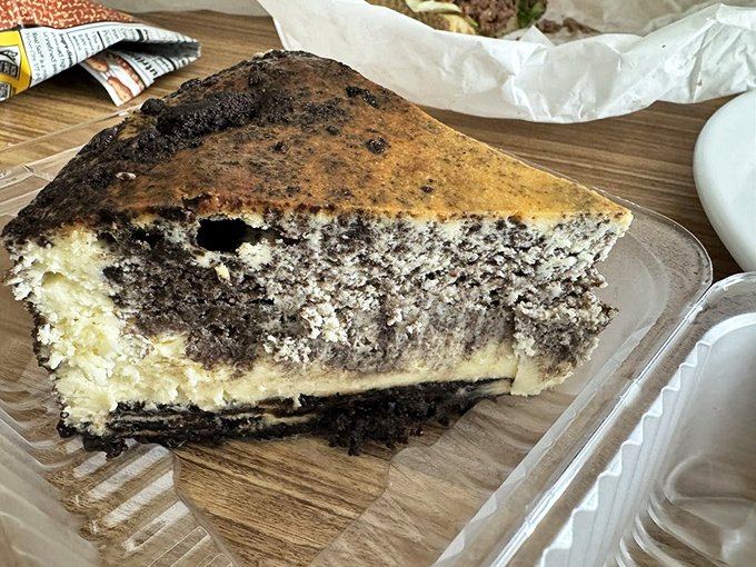The Oreo cheesecake performs a delicate balancing act between sophisticated dessert and childhood nostalgia, with a crust that crumbles just right with each forkful.