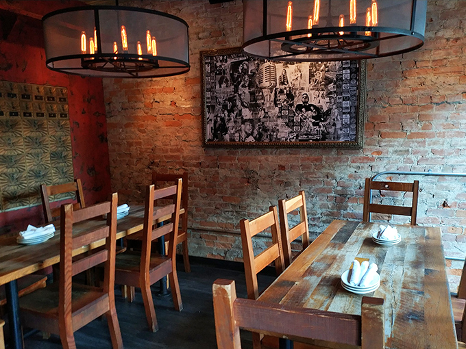 Exposed brick walls and wooden tables create a dining room that feels both timeless and perfectly of-the-moment. History with an appetite.