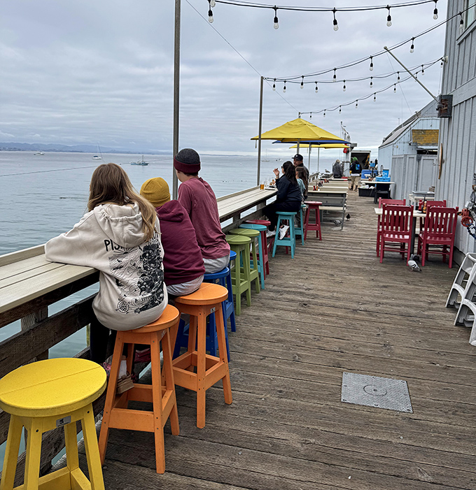 Colorful stools line the deck like a rainbow of invitation, each offering front-row seats to nature's greatest show&mdash;the endless Pacific horizon.