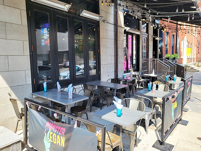 Outdoor dining with a side of people-watching. Those blue drinks look like they contain secrets from another dimension.