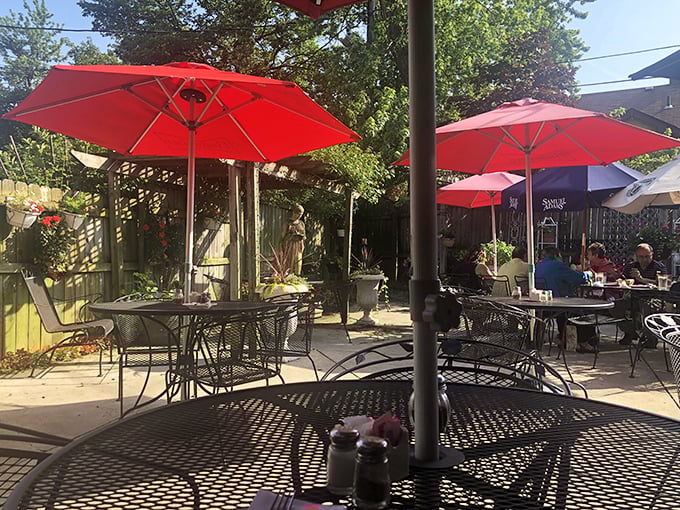 Summer dining under those cherry-red umbrellas feels like stumbling upon a secret garden where pasta dreams come true.