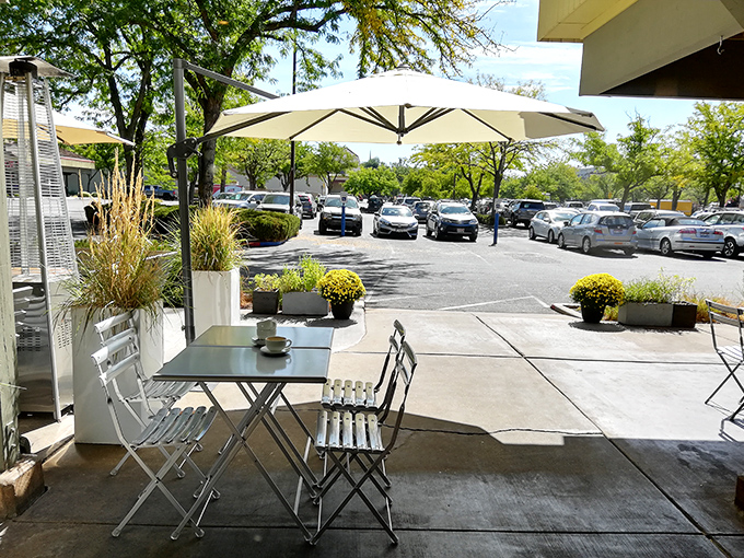 A quiet moment waiting to happen. This outdoor seating area whispers, "Sit down, slow down, and savor something special."