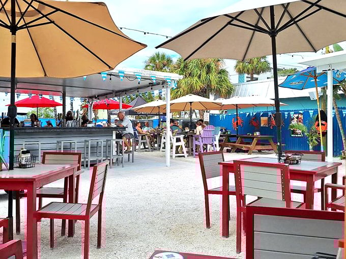 Outdoor dining under umbrellas where the Gulf breeze does double duty as both air conditioning and appetite enhancer.