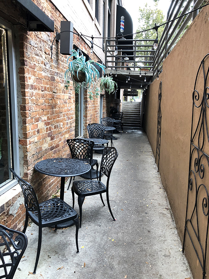 The hidden alley seating feels like discovering a secret garden, minus the garden but with 100% more coffee potential.