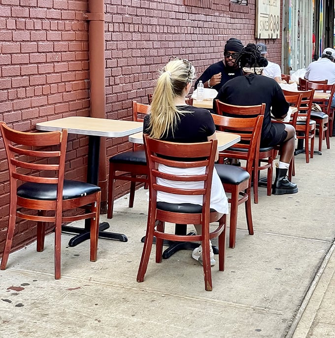 Sidewalk dining at Katz's &ndash; where you can people-watch while your sandwich watches you, wondering if you're worthy of its deliciousness.