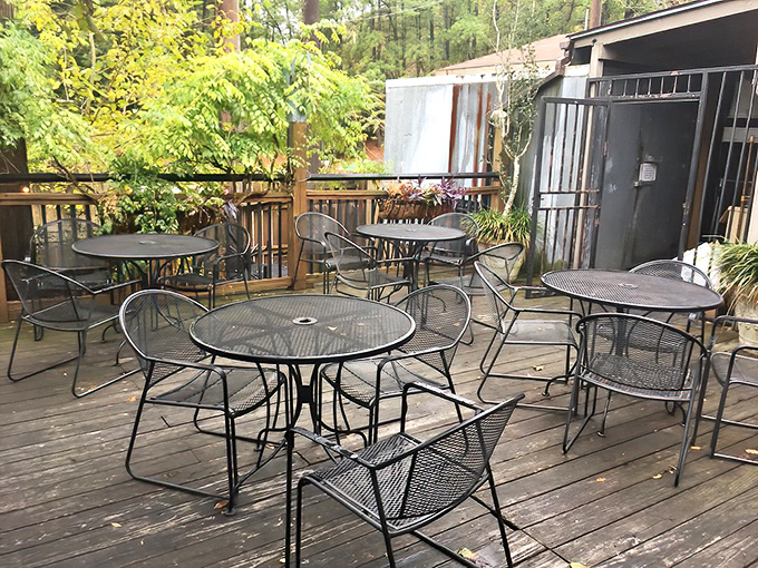 The outdoor deck offers a tranquil escape among the trees. On pleasant Arkansas evenings, these tables become the most coveted seats in town.