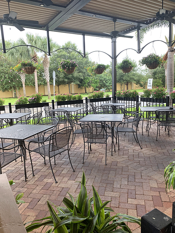 Florida sunshine meets British leisure. The covered patio offers al fresco dining with hanging plants&mdash;something you'd rarely enjoy in actual British weather.