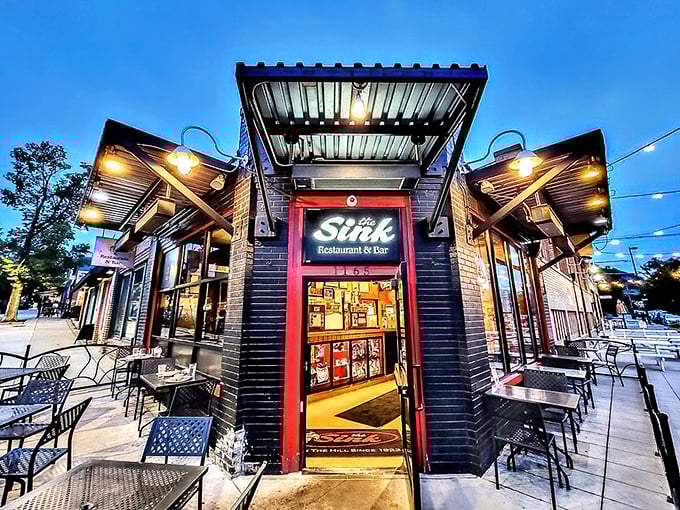 As dusk falls, The Sink's exterior lights up like a beacon for the burger-obsessed. Those string lights aren't decoration&mdash;they're a homing signal.