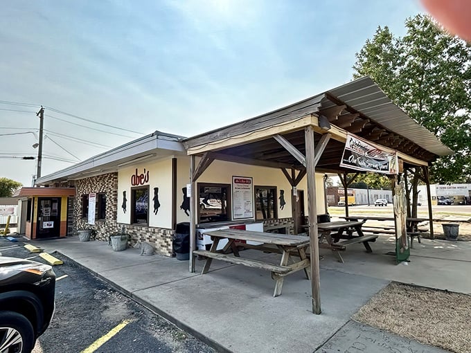 Sun-dappled picnic tables under the covered porch offer the quintessential Mississippi dining experience: casual, communal, and completely satisfying.