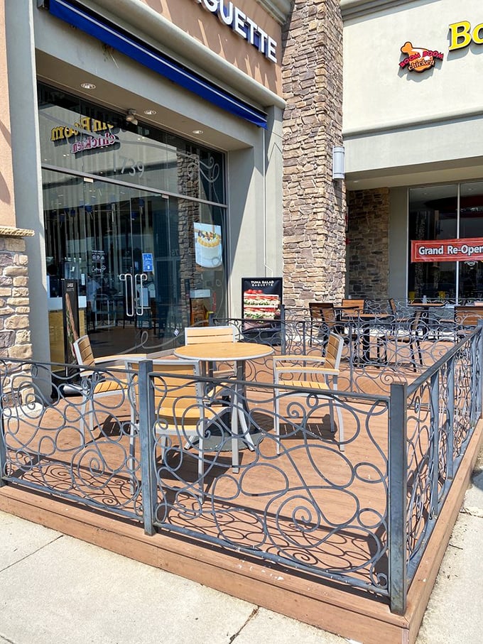 The outdoor seating area invites you to linger with your treats, watching the world rush by while you savor each bite with the smugness of someone who's found a hidden gem.