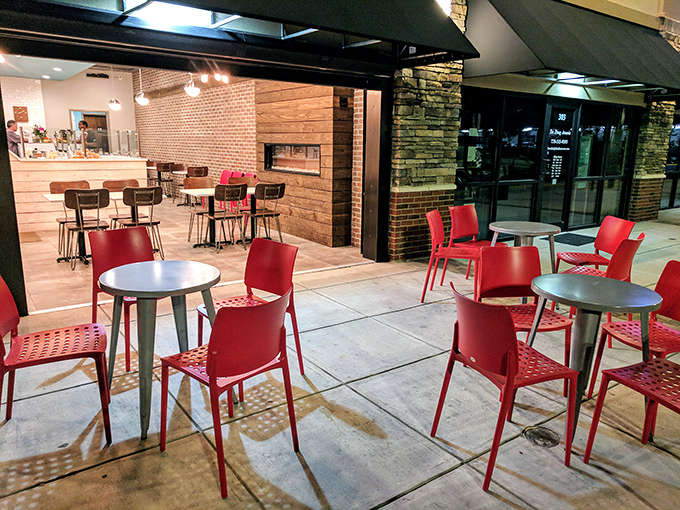 The outdoor seating area with those punchy red chairs invites you to linger. Georgia evenings were made for custard on the patio.